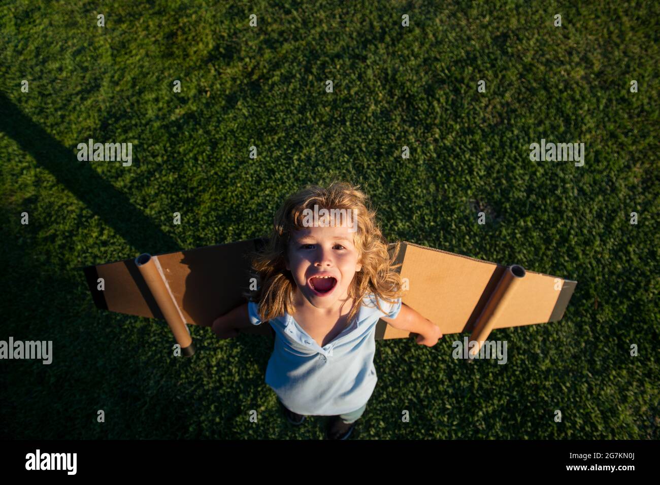Laughing boy kid traveller with backpack wings. Child playing pilot ...
