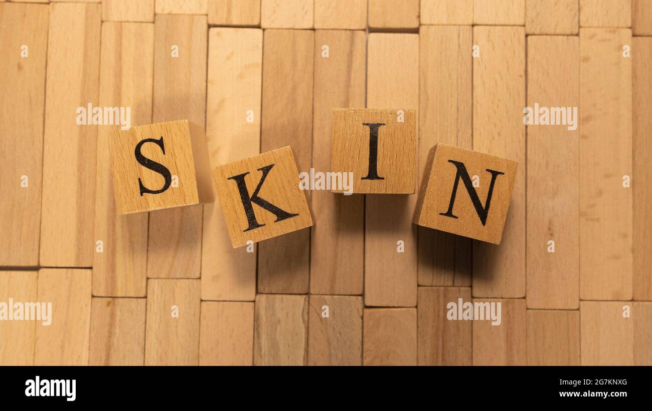 The word skin was created from wooden letter cubes. Disease and health ...