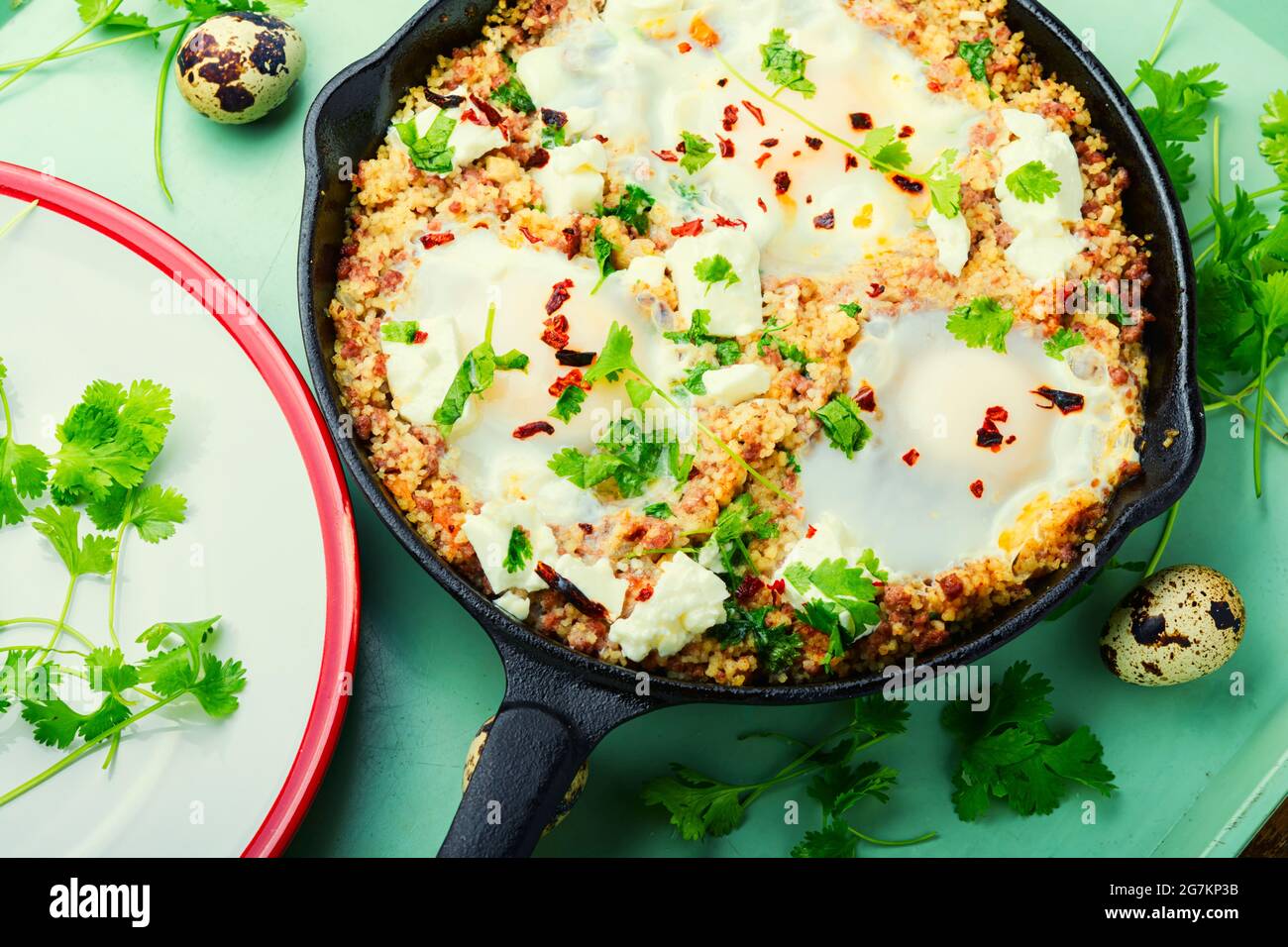 Israeli shakshuka made from fried eggs, tomato, minced lamb and hot ...