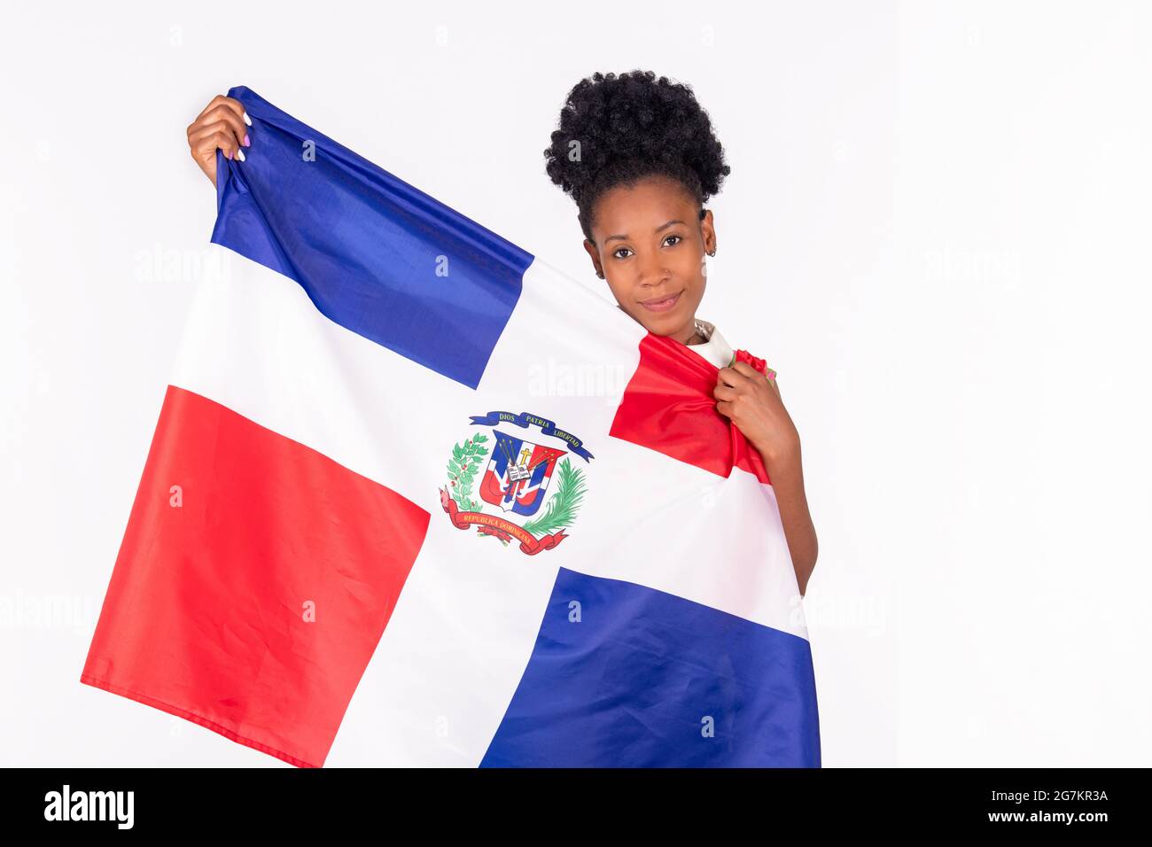 Cute latina woman holding the Dominican Republic flag with a loving ...