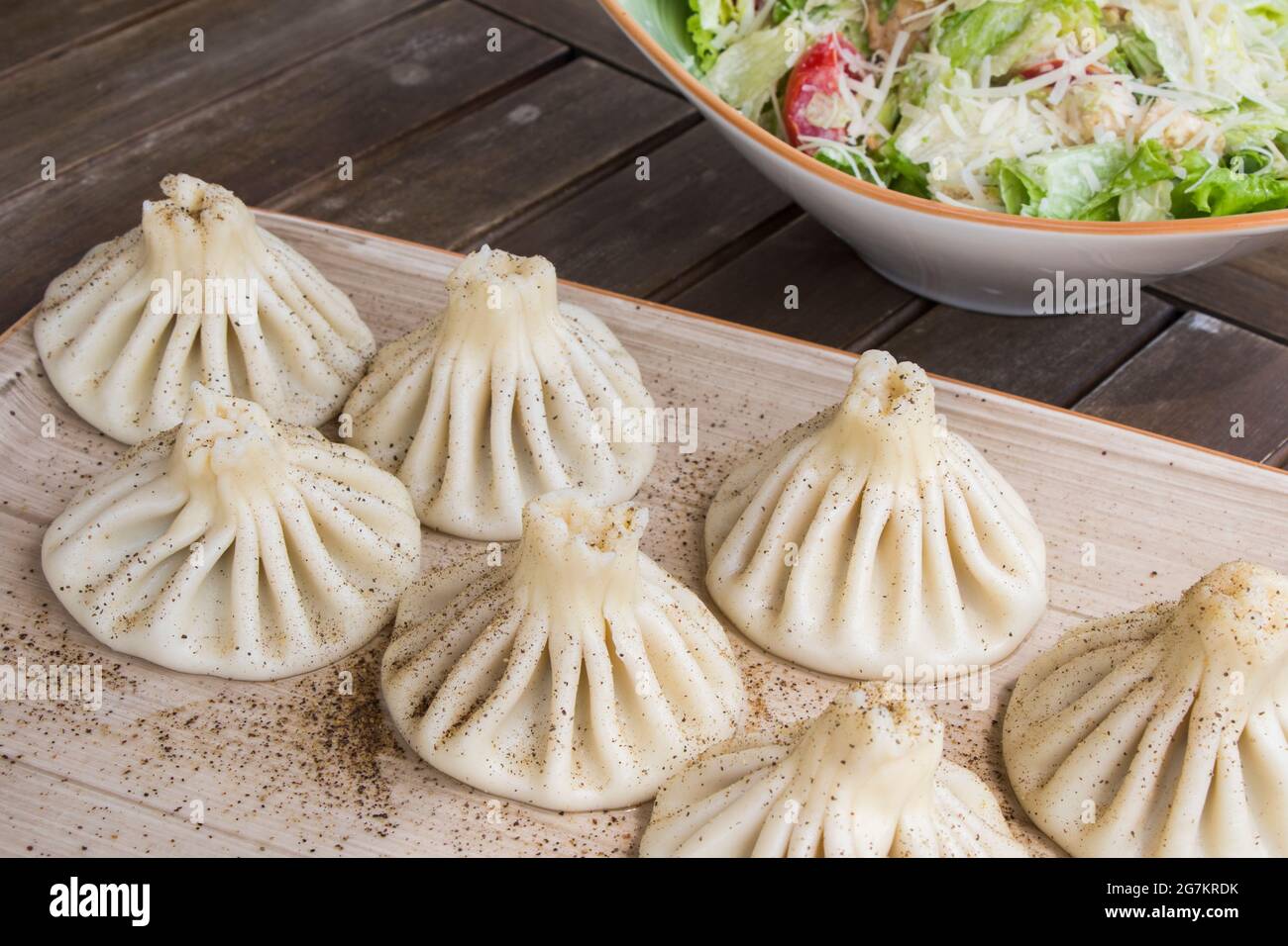 Georgian traditional food khinkali on the plate in restaurant, ready to ...