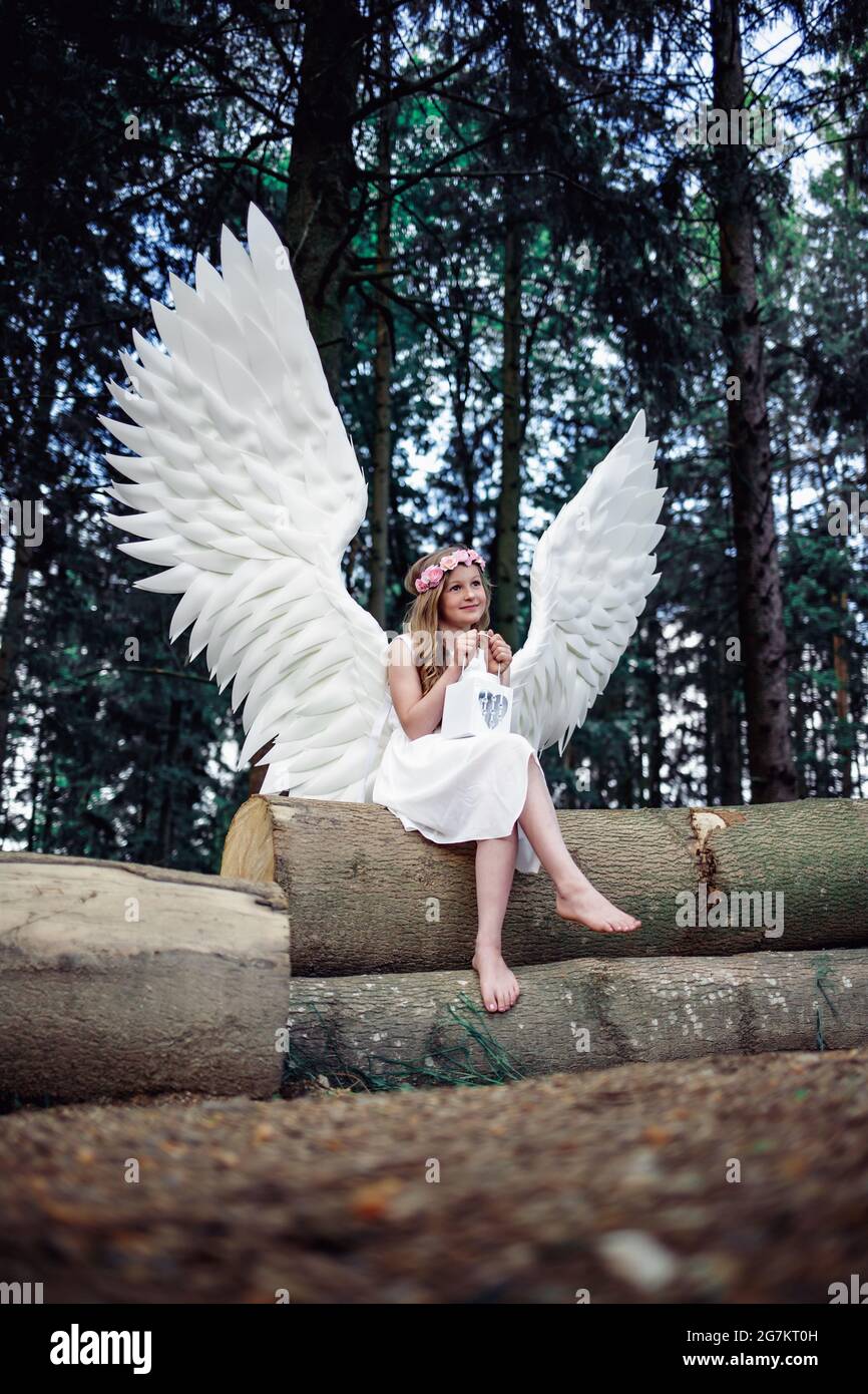 Girl in angel wings face hi-res stock photography and images - Alamy
