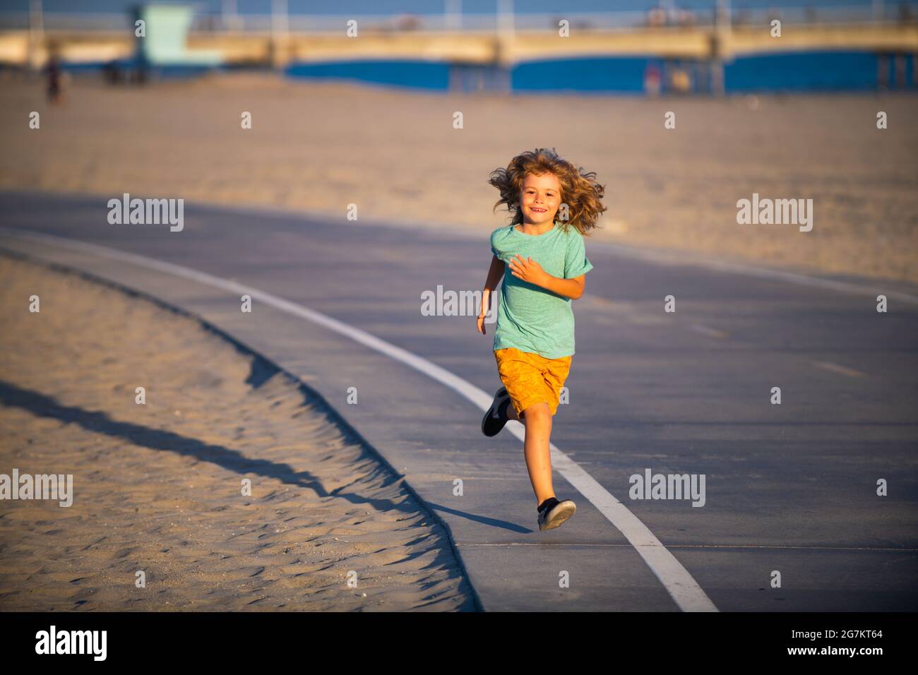 Cheerful child boy running to school. Kids run race Stock Photo - Alamy
