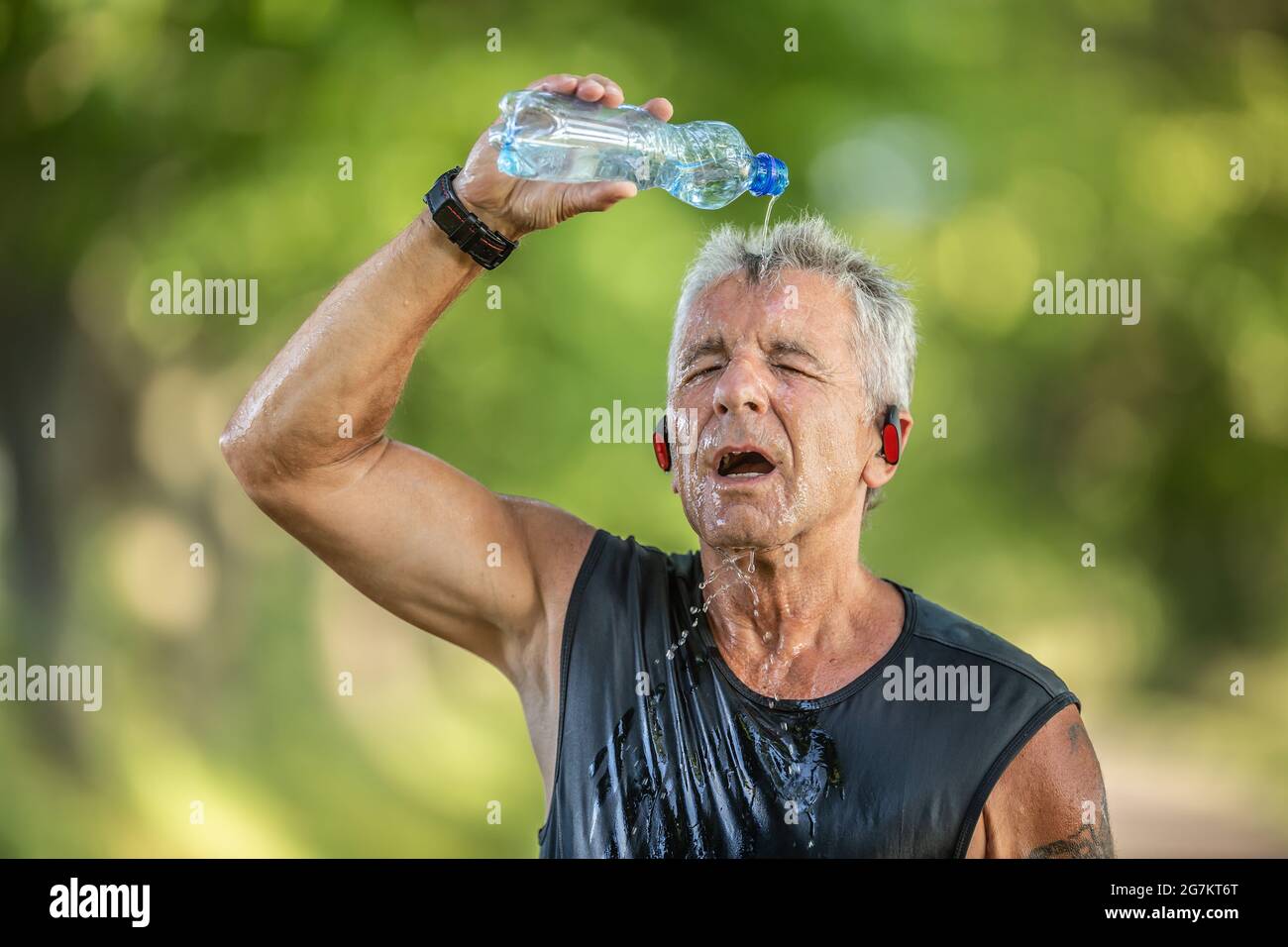 Pouring water over his head hi-res stock photography and images - Alamy