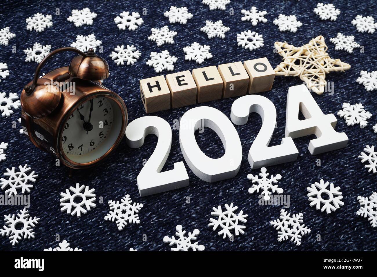 Hello 2024 alphabet letter decorate with alarm clock on blue knitted fabric background Stock ...
