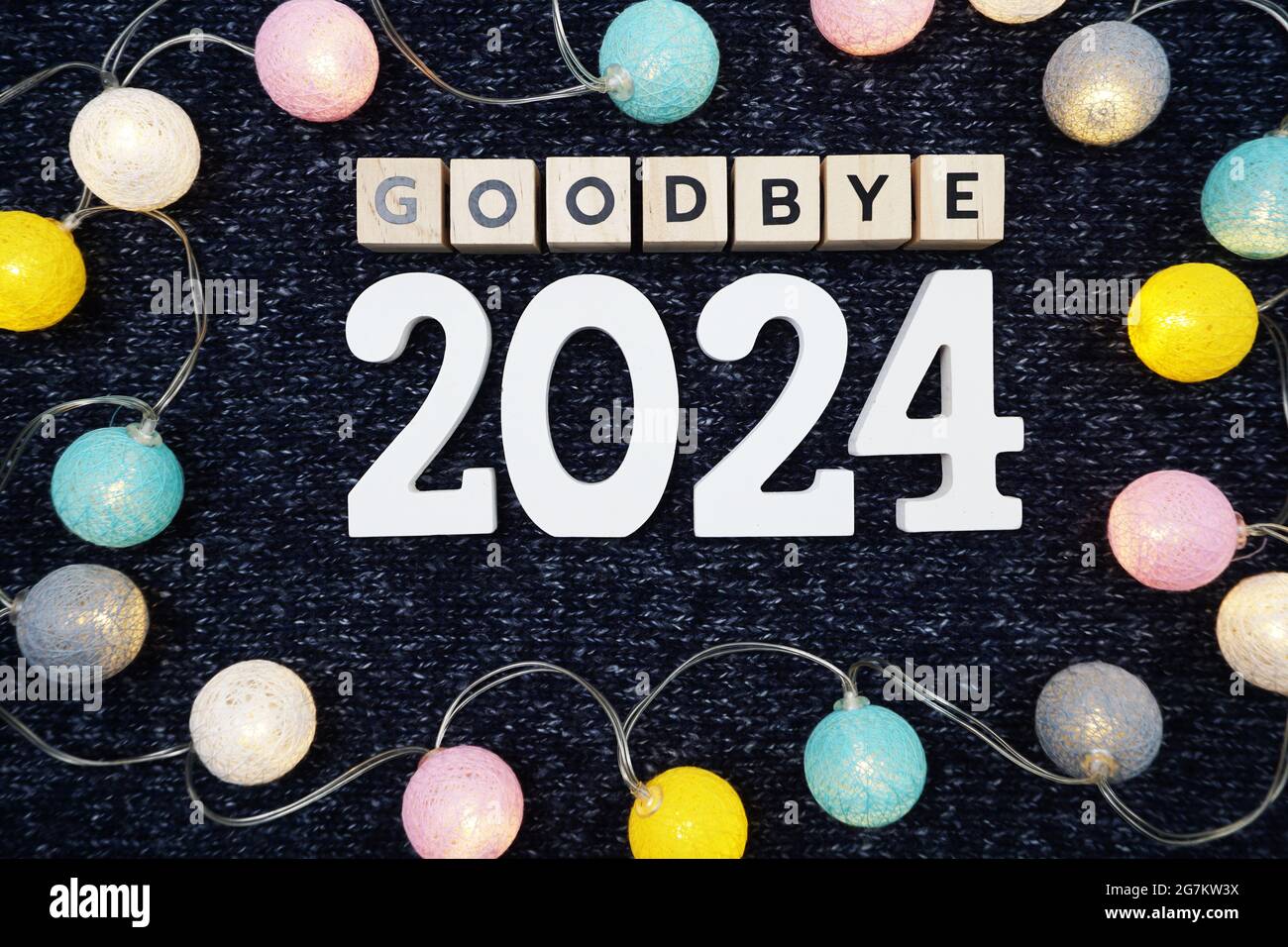Goodbye 2024 alphabet letter decorate with LED cotton ball on blue ...