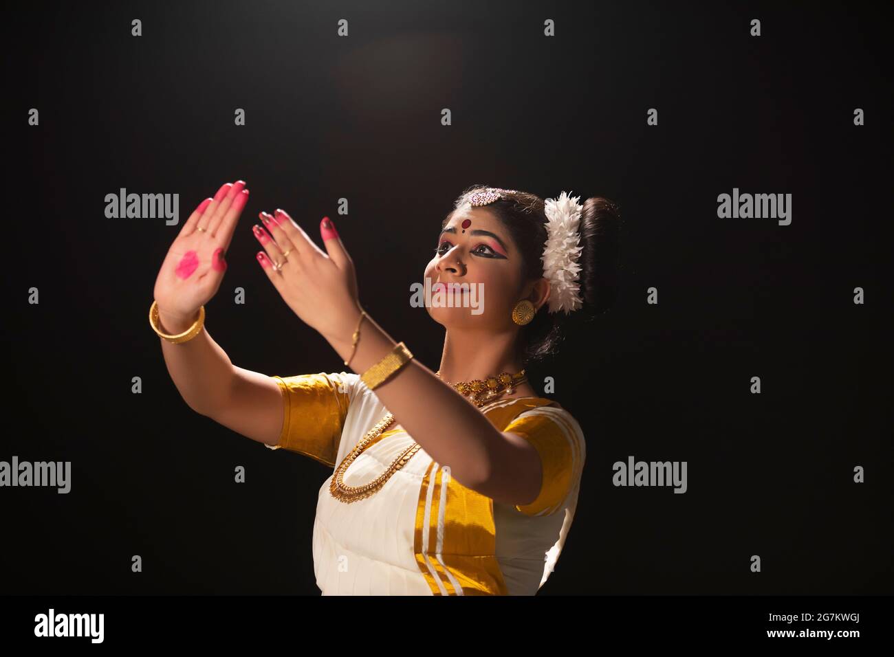 Woman depicting the ephemeral beauty of the moon through her dance ...