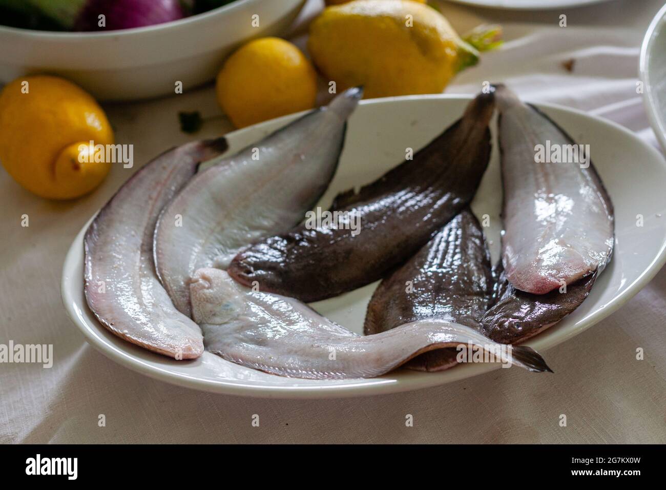 Closeup shot of marinated herring on a plate on a table Stock Photo - Alamy