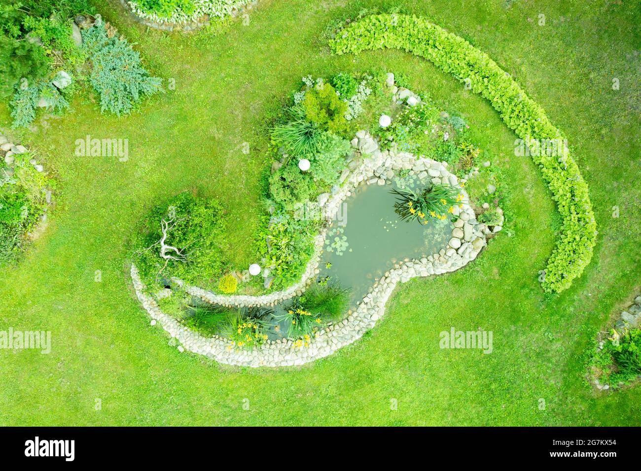 Aerial top view garden pond. Garden fish pond. Pond on natural ...