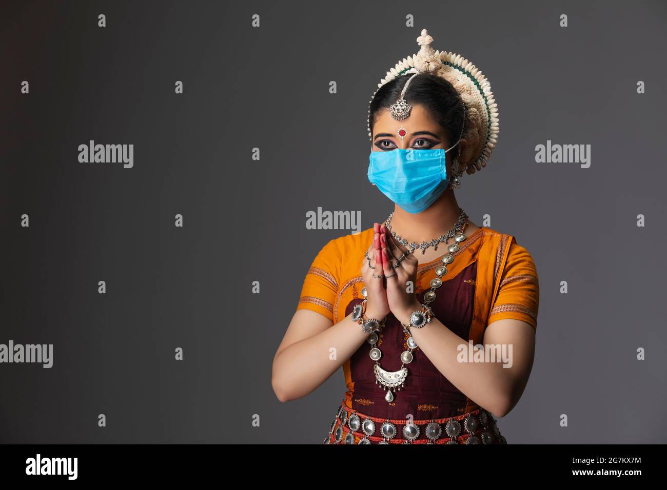 Odissi dancer wearing a mask Stock Photo - Alamy