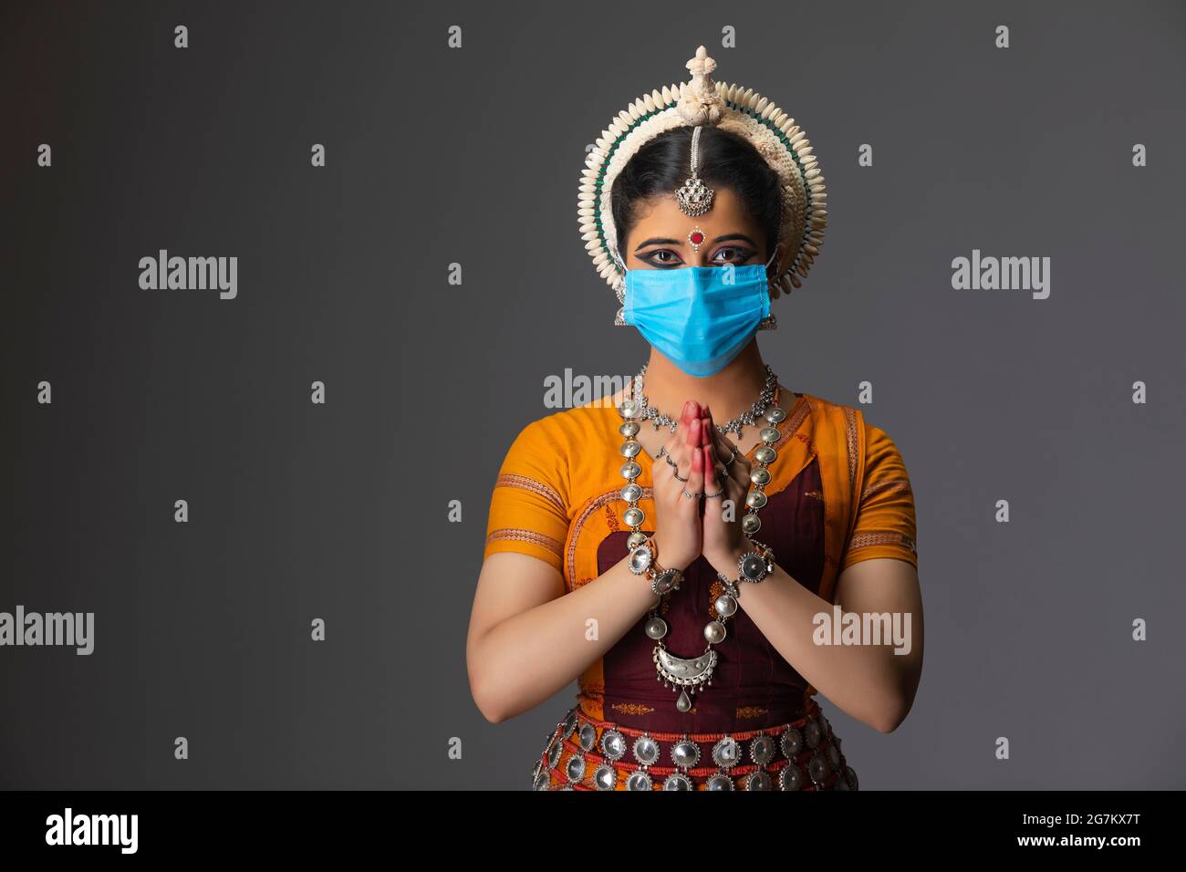 Odissi dancer wearing a mask Stock Photo - Alamy