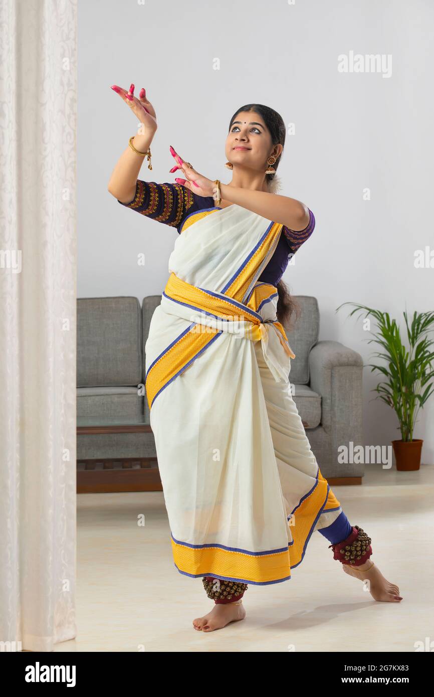 Mohiniattam dancer practicing pathaka mudra at home Stock Photo - Alamy