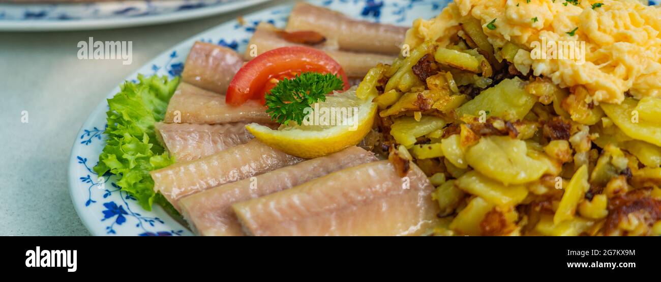 Smoked Eel - Fish filet on a plate with fried potatoes from Germany ...