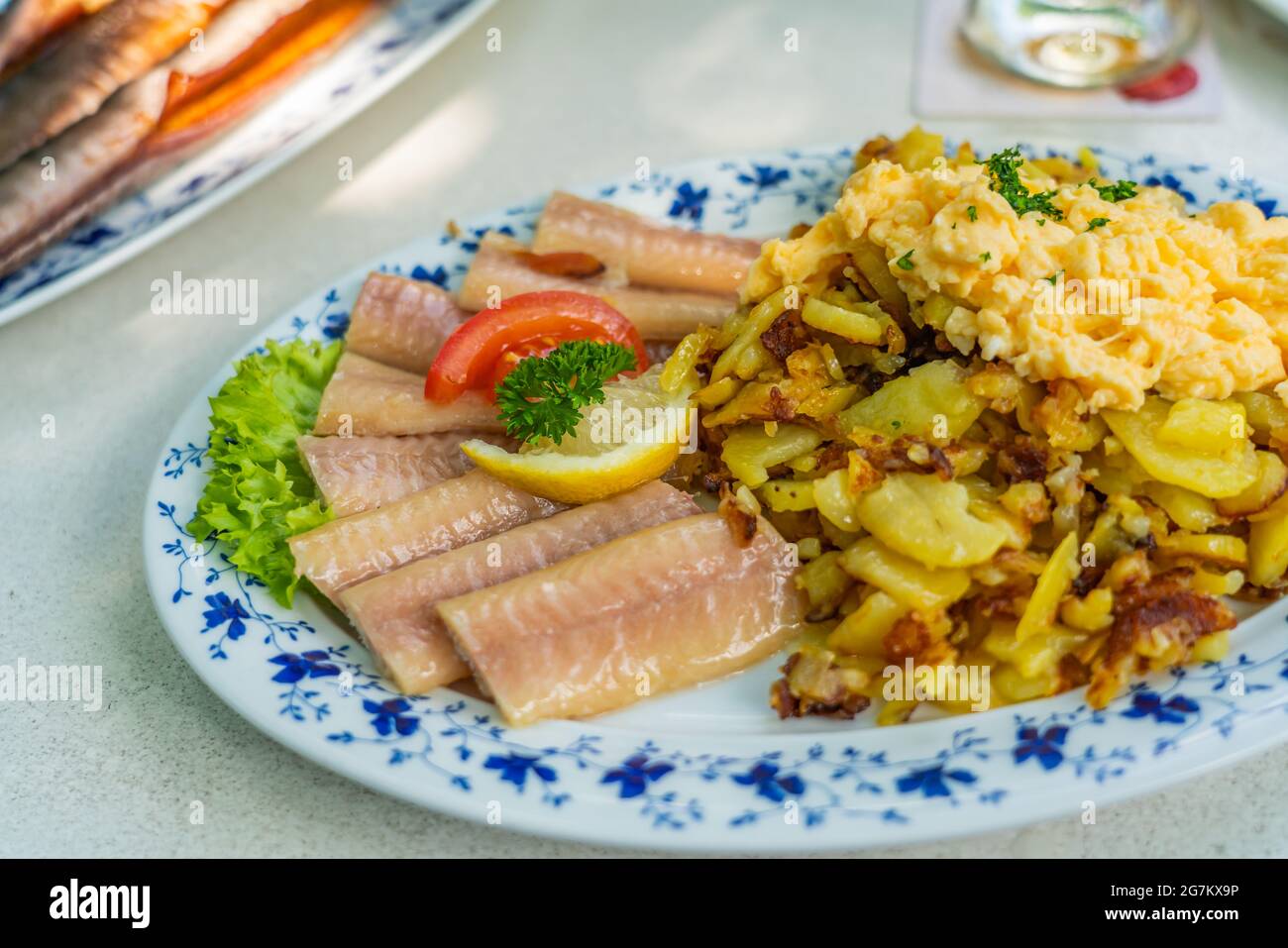 Smoked Eel - Fish filet on a plate with fried potatoes from Germany ...