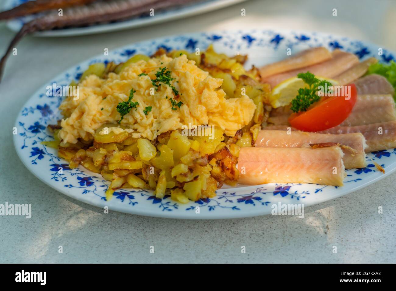 Smoked Eel - Fish filet on a plate with fried potatoes from Germany ...