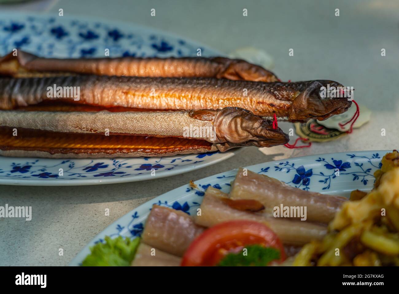 Smoked whole Eel - Fish on a plate with different lights from Germany ...