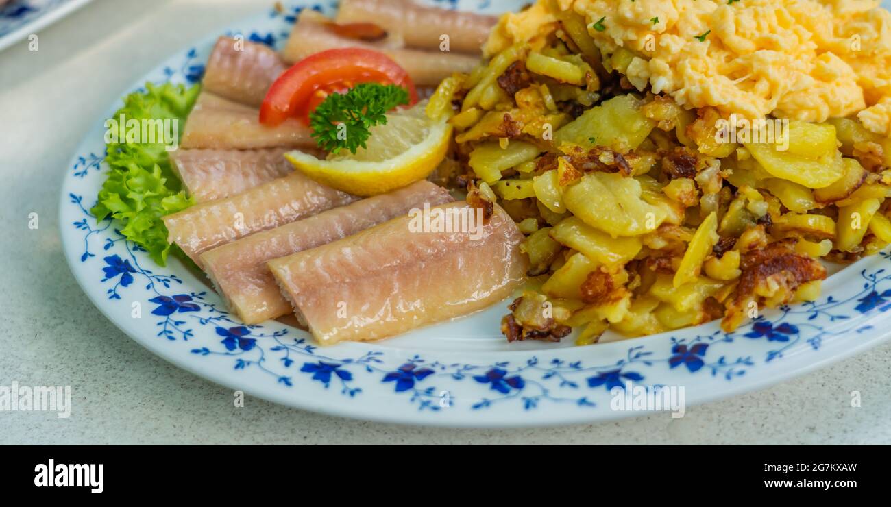 Smoked Eel - Fish filet on a plate with fried potatoes from Germany ...