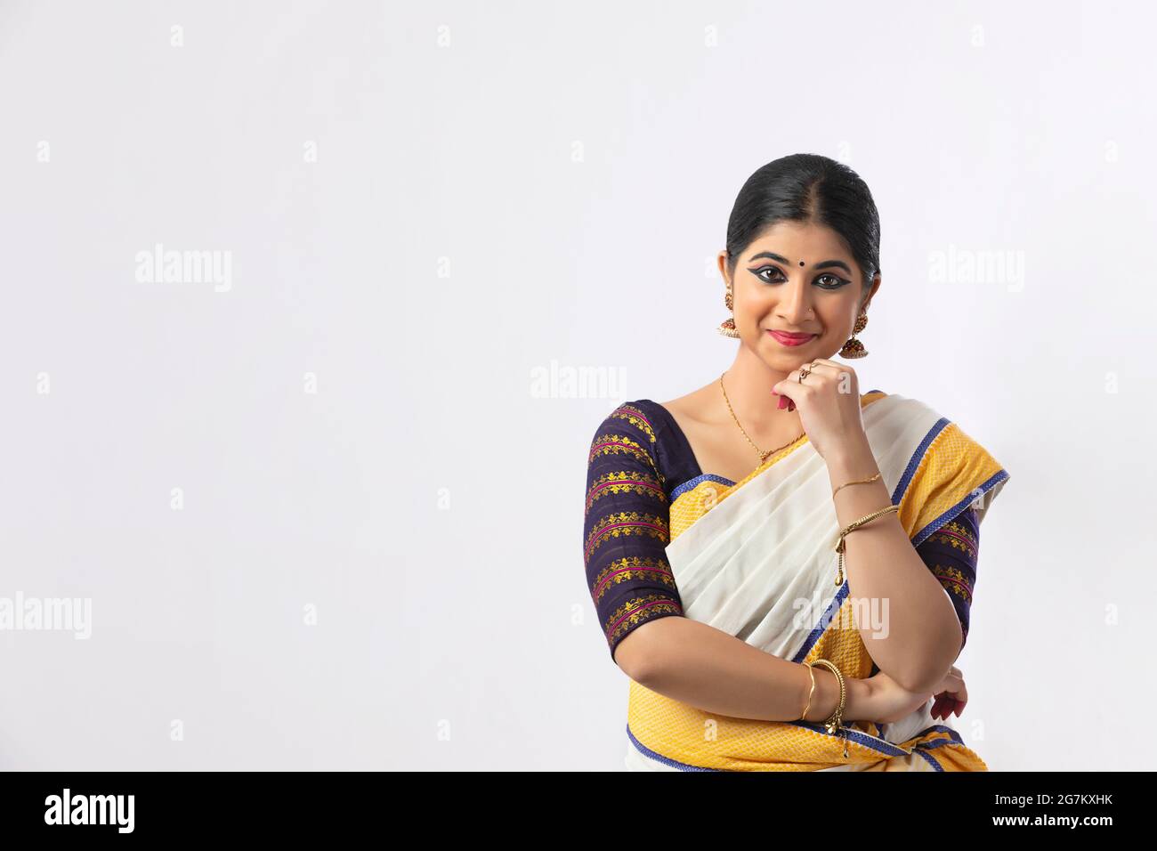 Indian classical dancer thinking about a pleasing incident and smiling ...