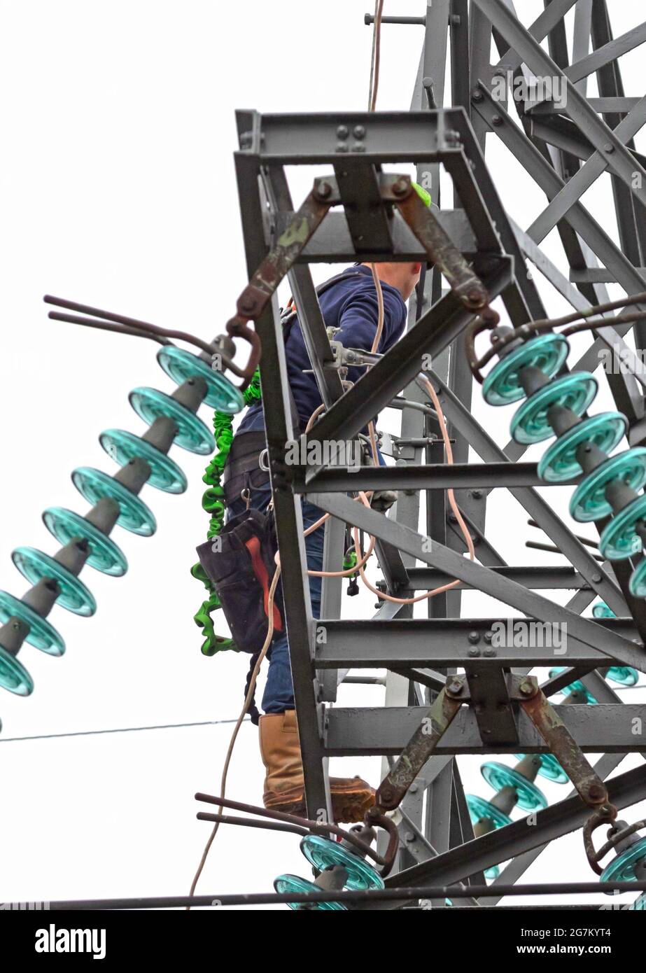 Electrician is working on a pole, high voltage Stock Photo - Alamy