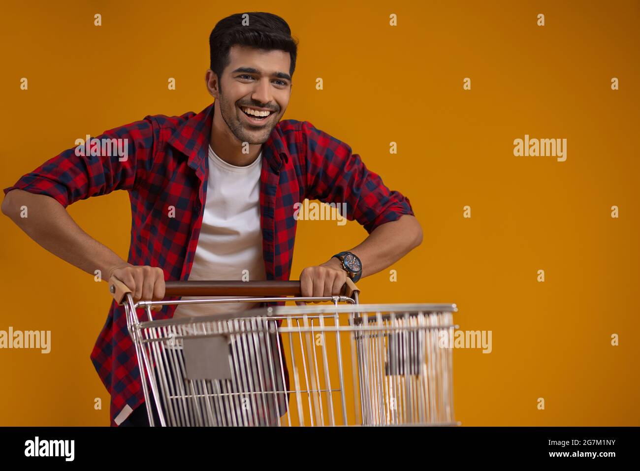 A young boy happily moving a trolley Stock Photo - Alamy