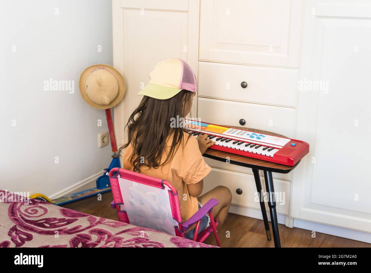 Young Hispanic girl playing piano Stock Photo - Alamy