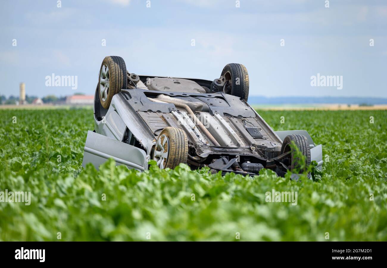 Car turned upside down after accident in a field, a peaceful ...