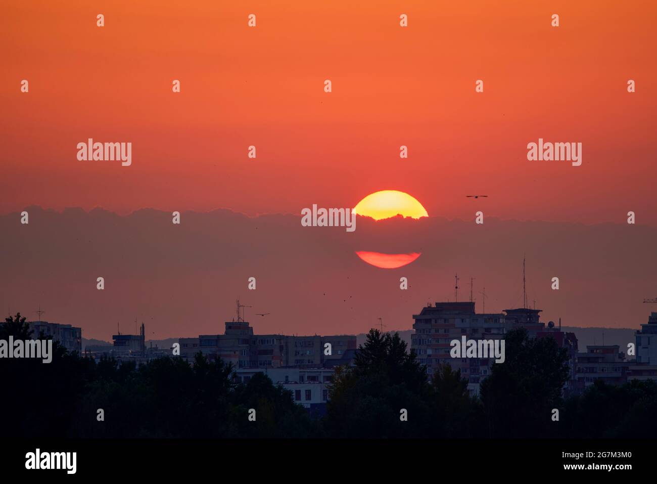 beautiful landscape with a sunset over the buildings of a city Stock ...
