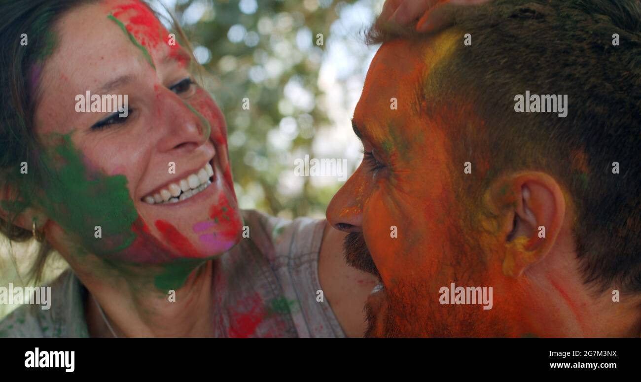 Closeup of a happy smiling Spanish couple with colored faces ...