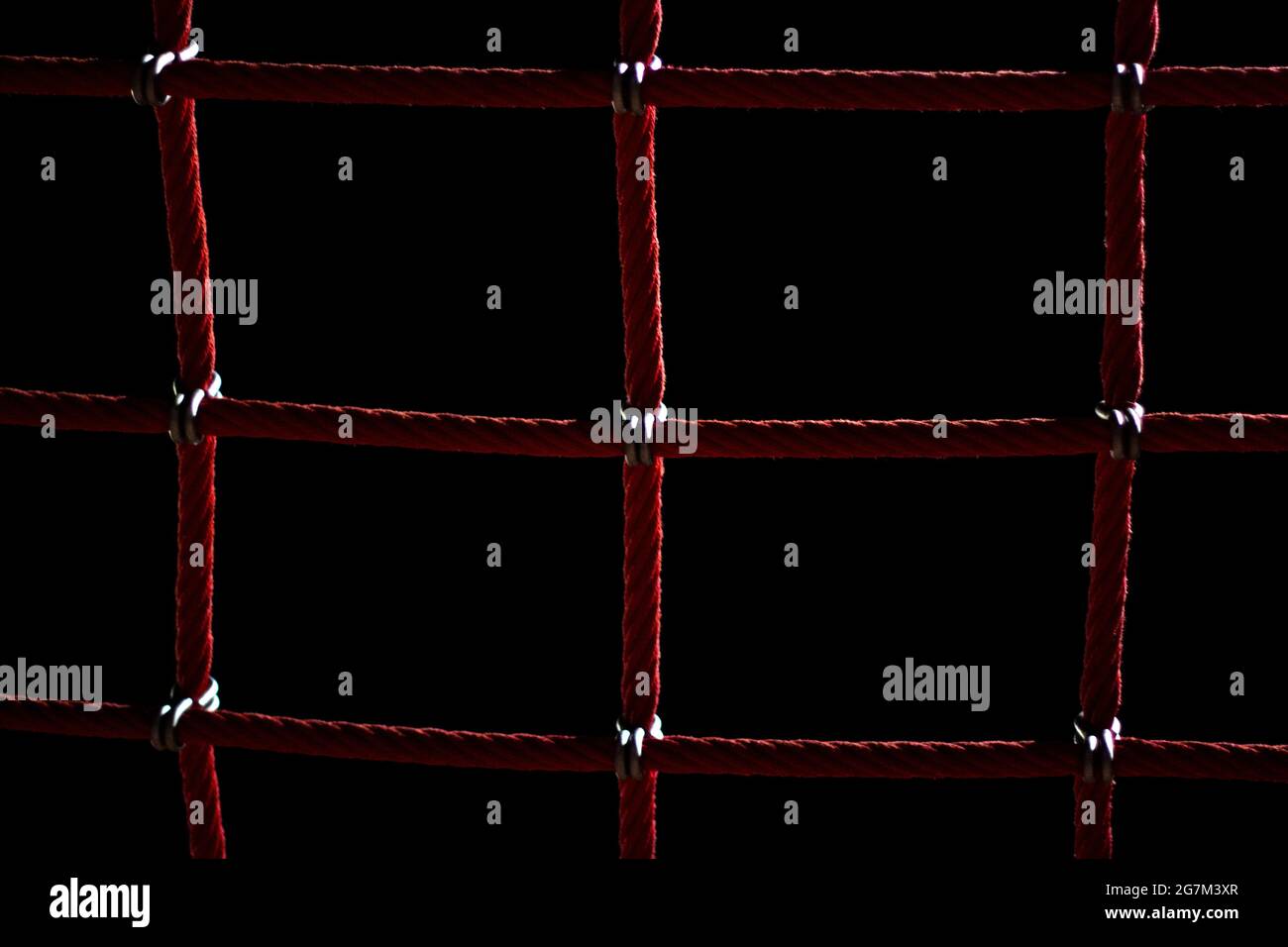 Ropes in the playground. Climbing net, shot close-up. Ropes fastened ...