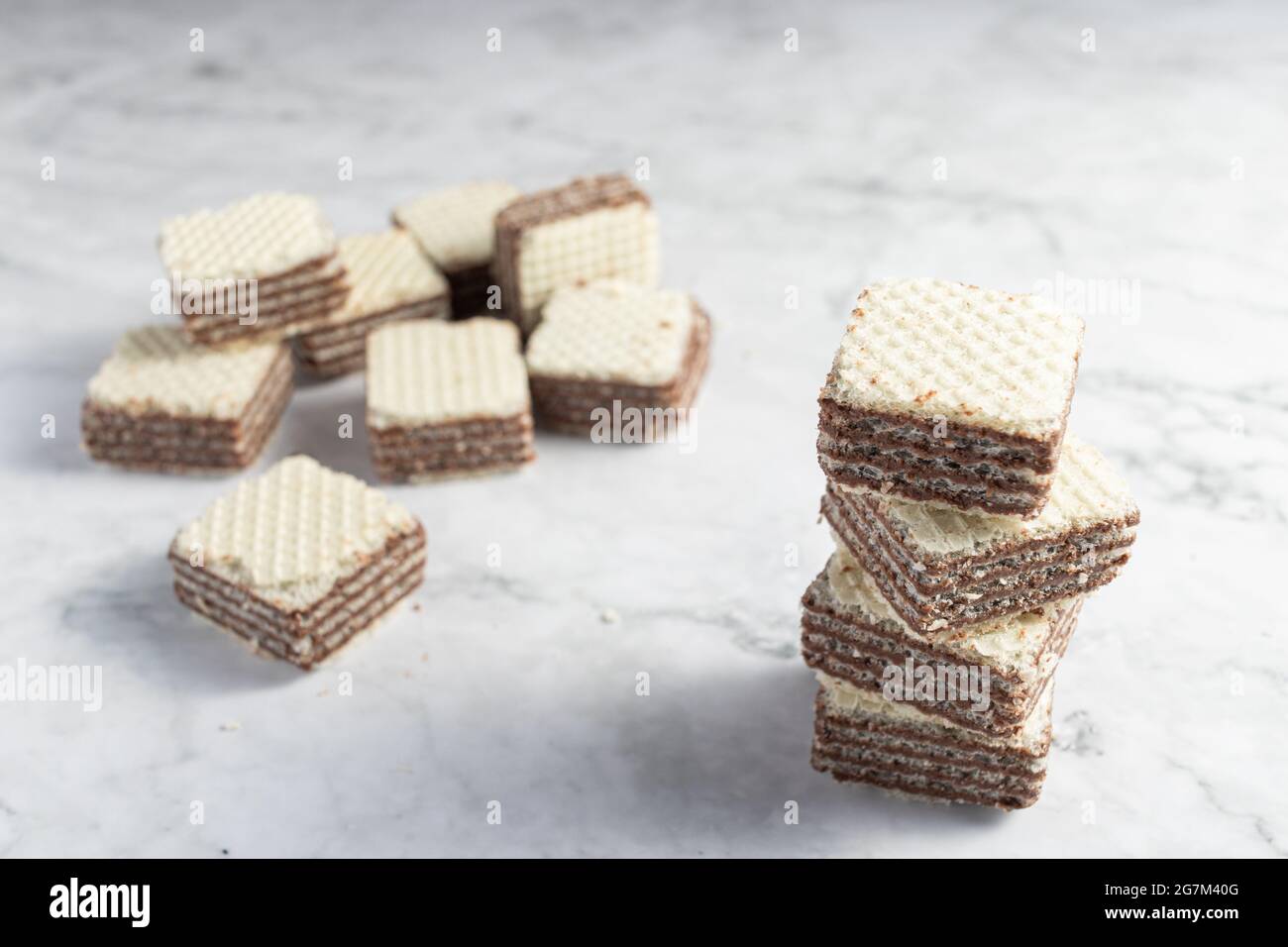 Closeup of square wafer biscuits with chocolate cream Stock Photo - Alamy