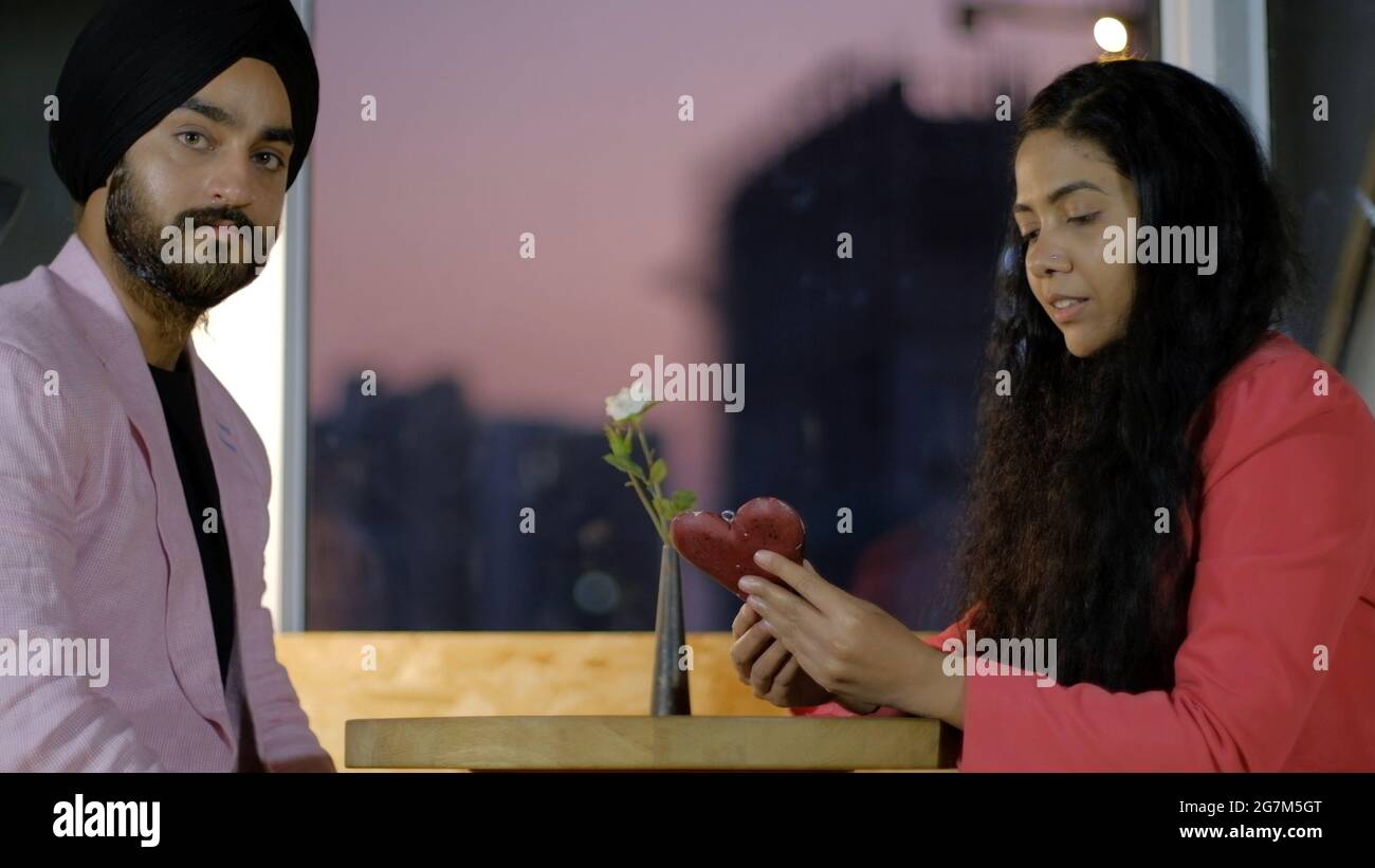 Cute Indian couple on a first date in a restaurant Stock Photo - Alamy