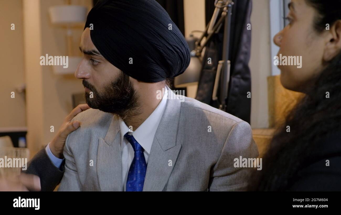 Group of Indian co-workers having a discussion during a business ...