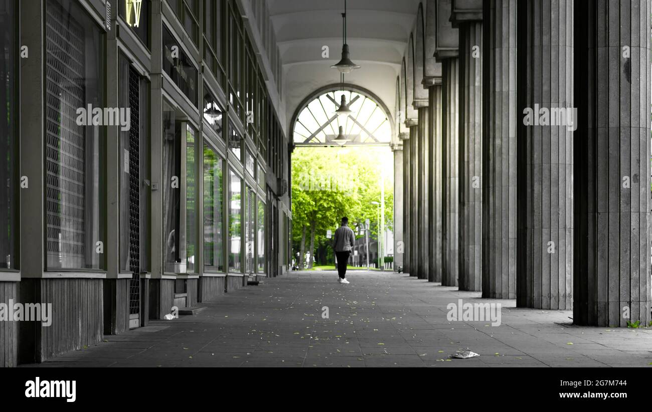 Rear View of One Man Walking at Corridor Stock Photo - Alamy