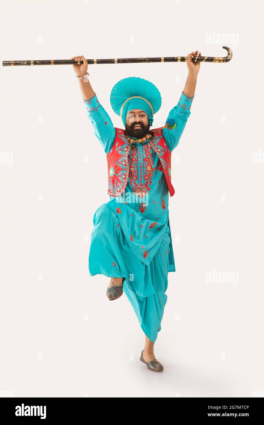 A Bhangra Dancer performing with Khunda Stock Photo - Alamy