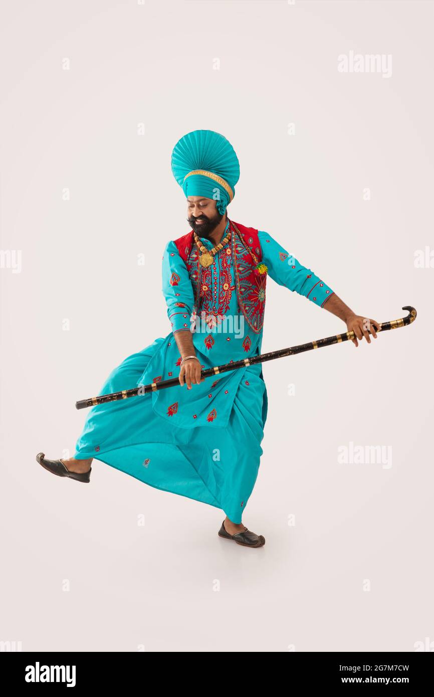 A Bhangra Dancer performing with Khunda Stock Photo - Alamy