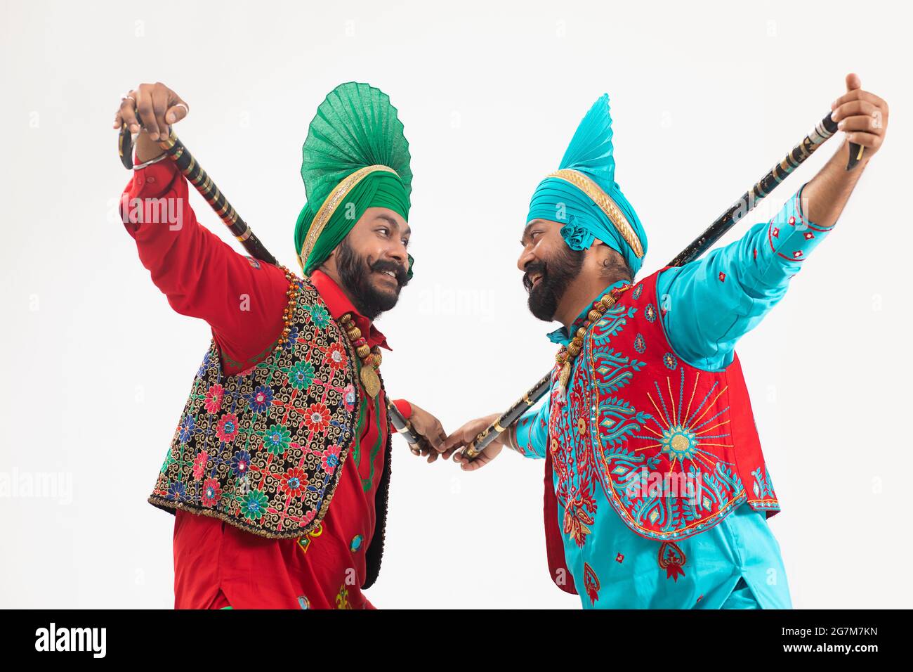 Two Bhangra Dancers standing with Khunda behind their neck Stock Photo ...