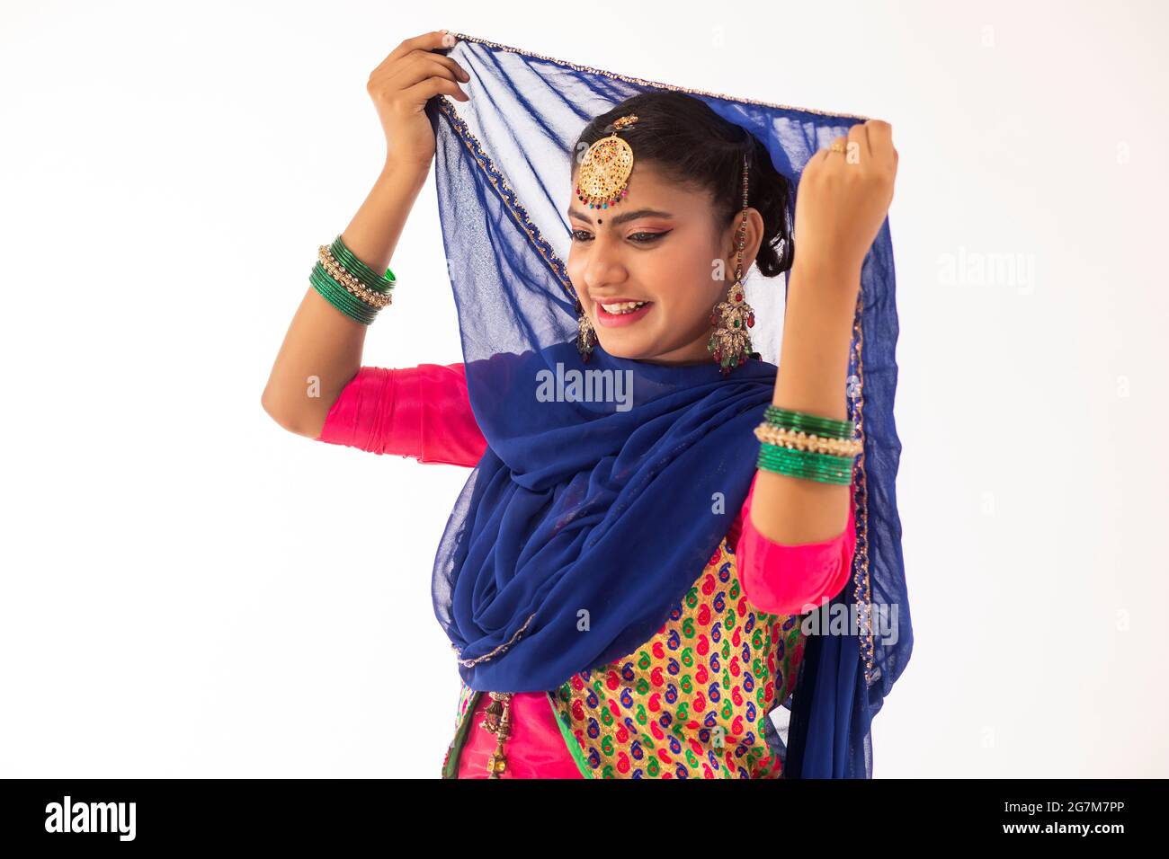 A Giddha dancer performing a Dance step with her chunni Stock Photo - Alamy