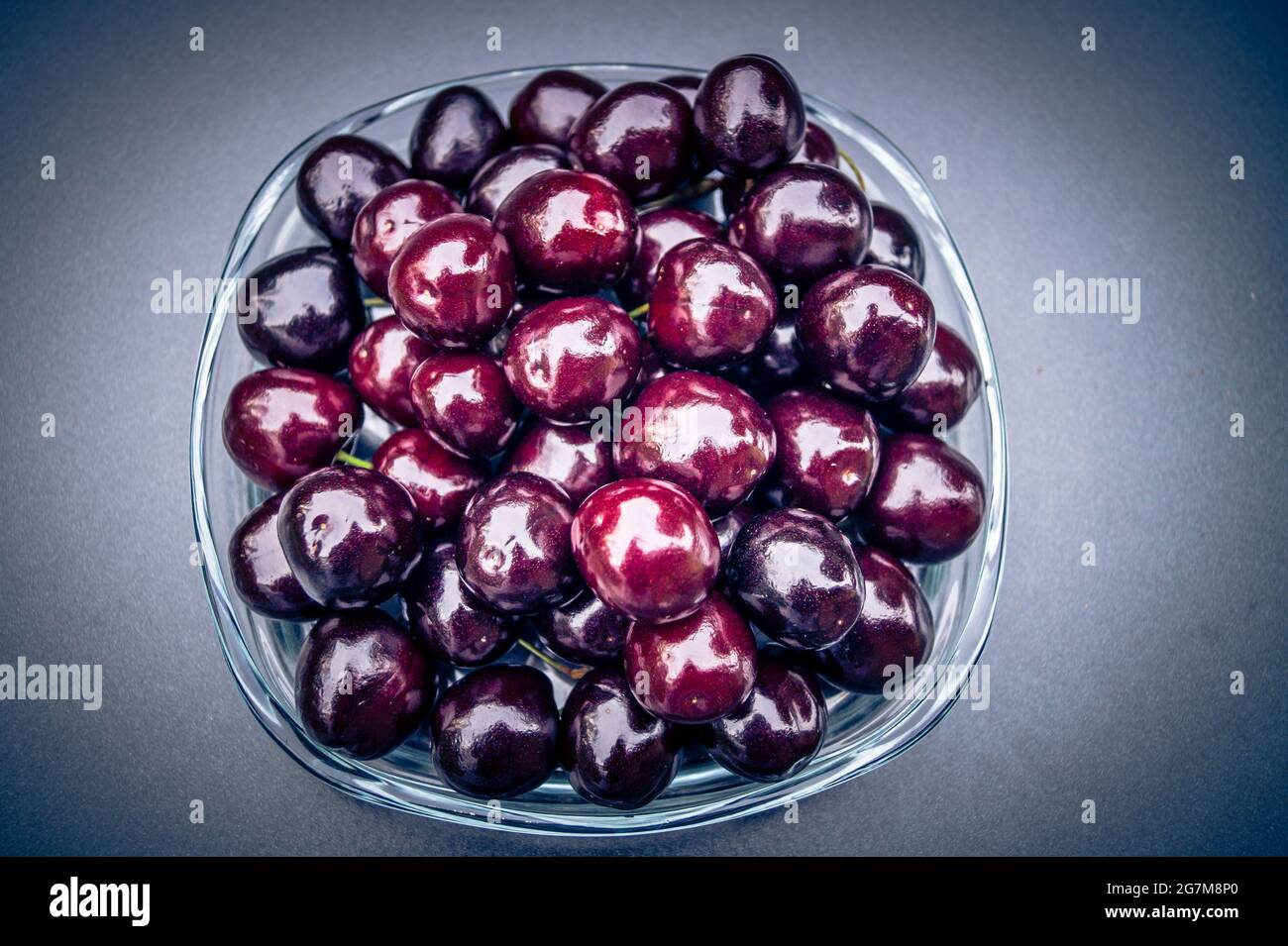 a stack of dark sweet cherries Stock Photo - Alamy