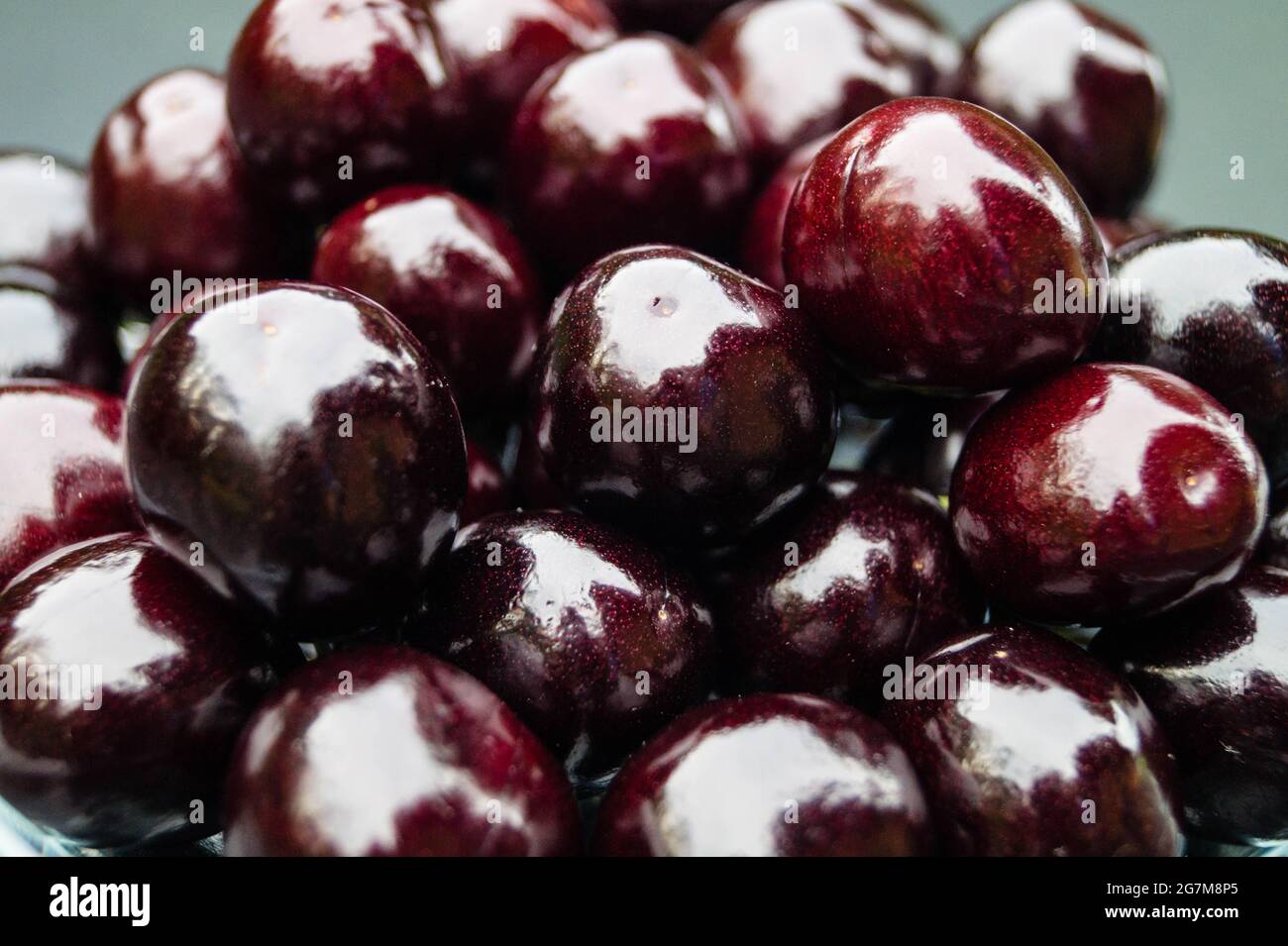 a stack of dark sweet cherries Stock Photo - Alamy