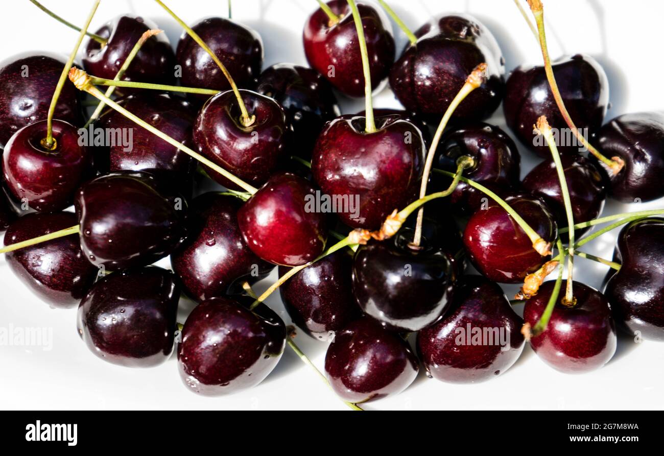 a stack of dark sweet cherries Stock Photo - Alamy