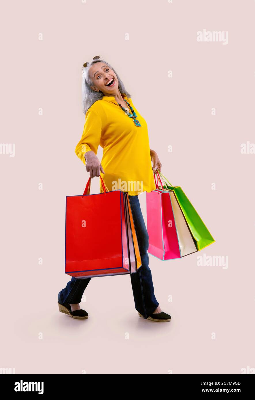 Woman carrying handbags hi-res stock photography and images - Alamy