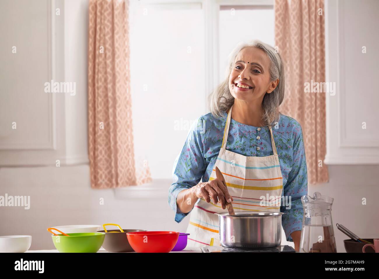 Indian old woman cooking food hi-res stock photography and images - Alamy