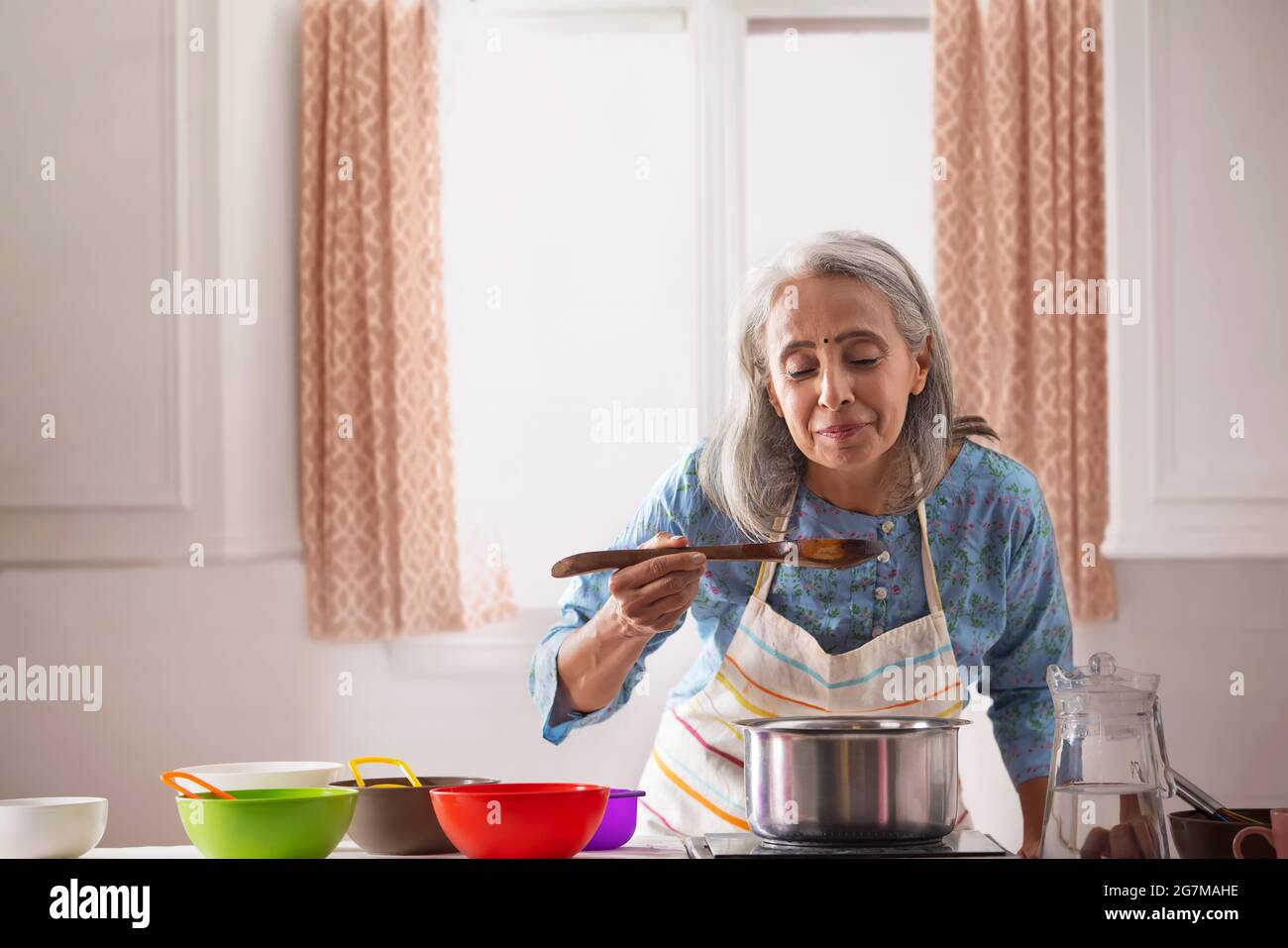 Indian old woman cooking food hi-res stock photography and images - Alamy