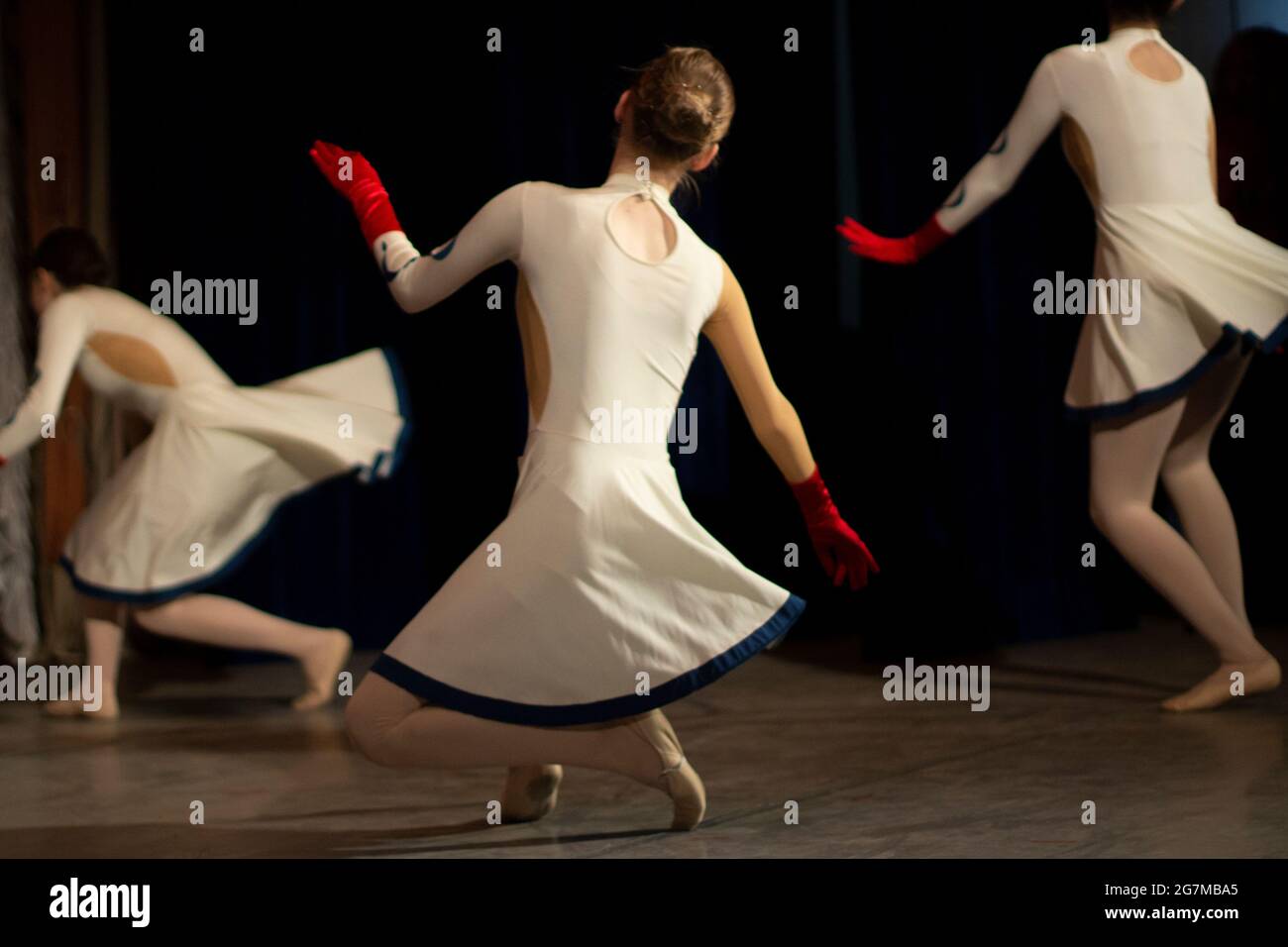 Girls dance on stage. Dance lesson. Beautiful girls in dresses perform ...