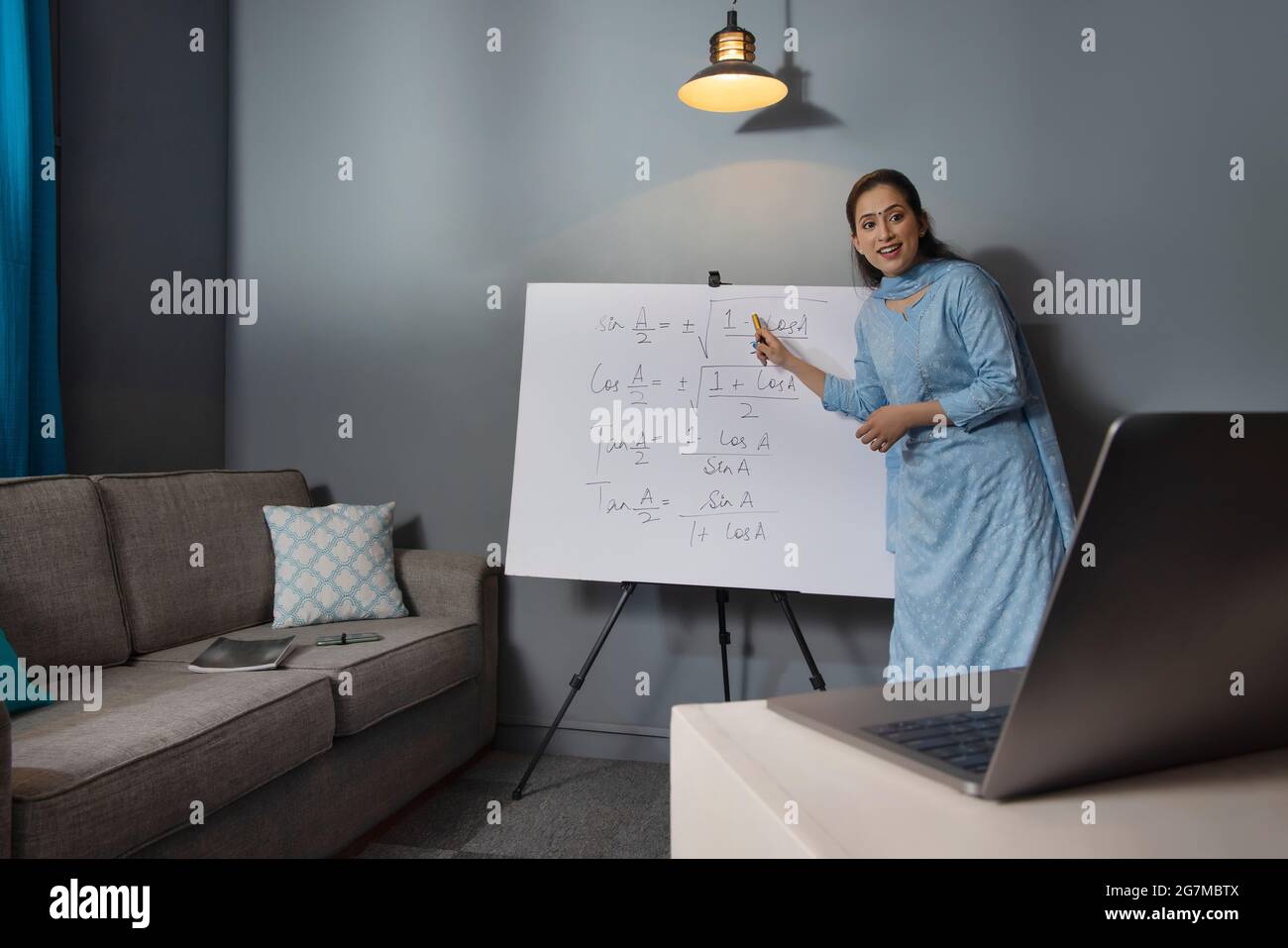 A woman teaching in an online class Stock Photo - Alamy