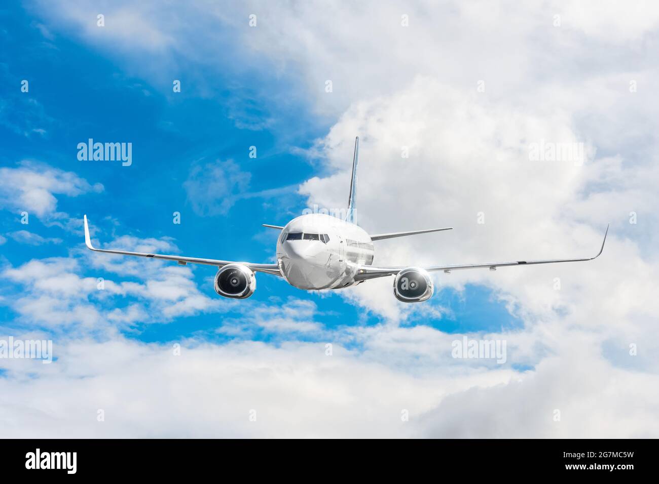 Passenger airplane flying at flight level high in the sky above the ...