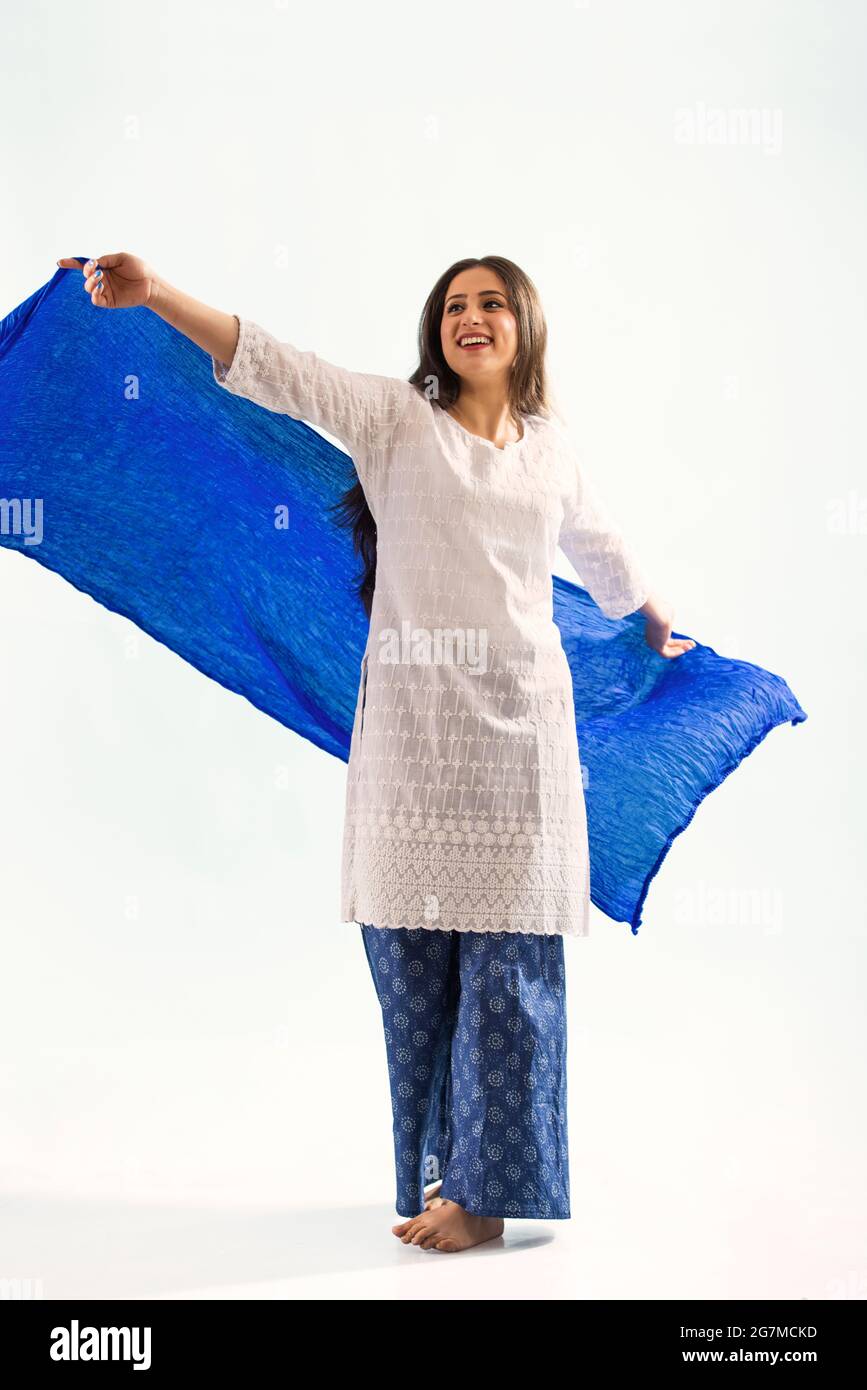 A woman in ethnic wear dancing with her chunni Stock Photo - Alamy