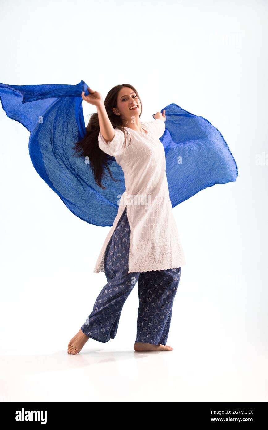 A woman in ethnic wear dancing with her chunni Stock Photo - Alamy