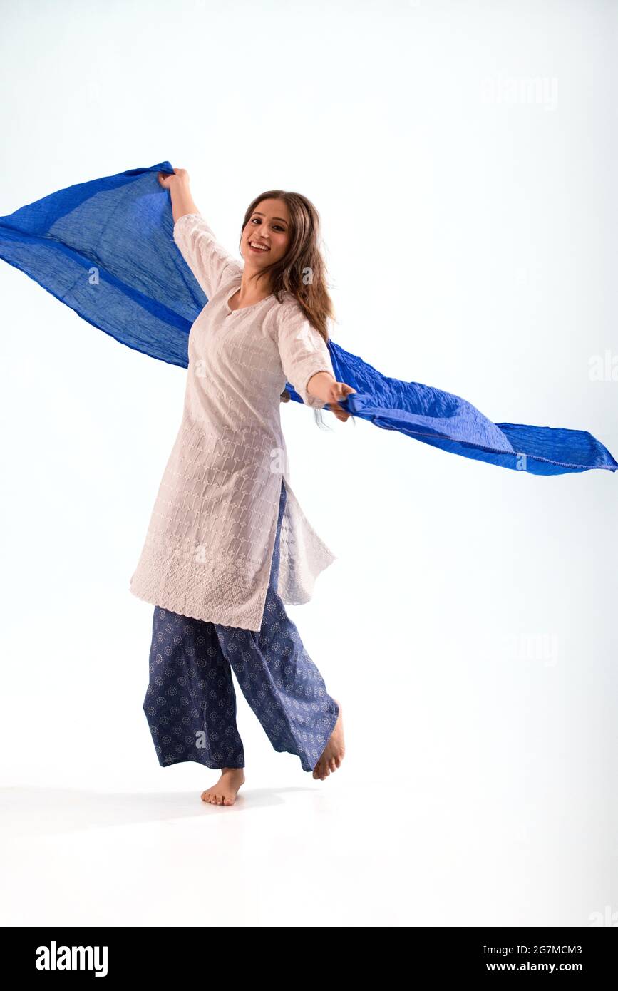 A woman in ethnic wear dancing with her chunni Stock Photo - Alamy