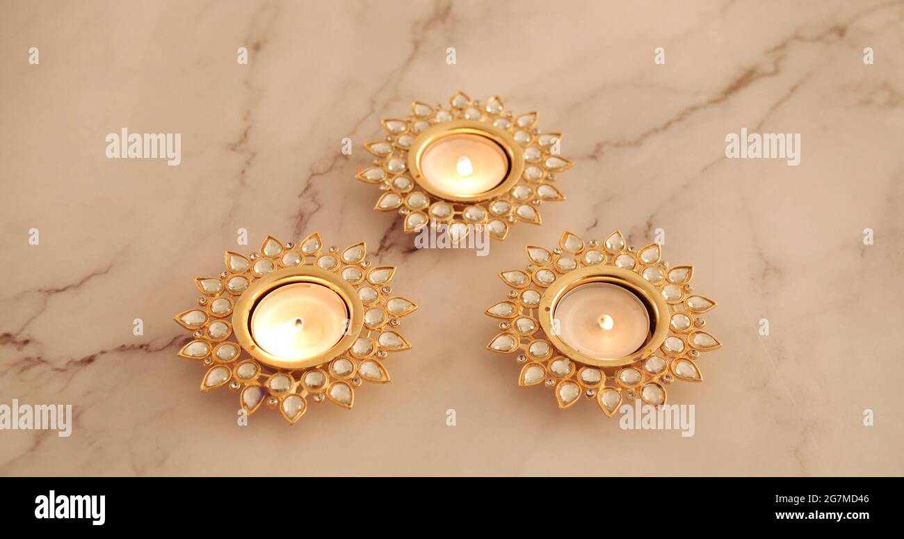 Candles for Diwali festival on marble surface Stock Photo - Alamy